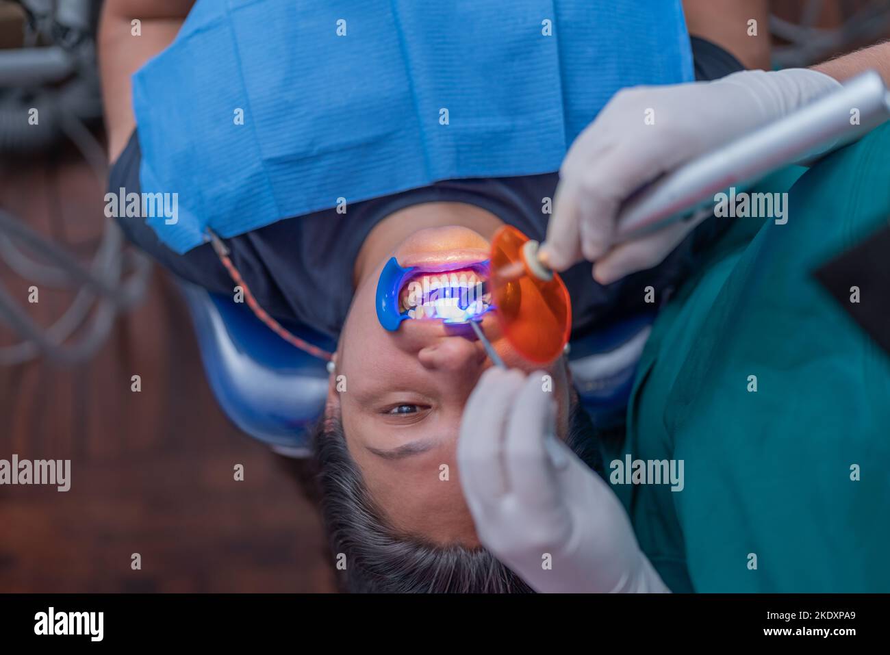 Top view of crop unrecognizable stomatologist in uniform and gloves ...