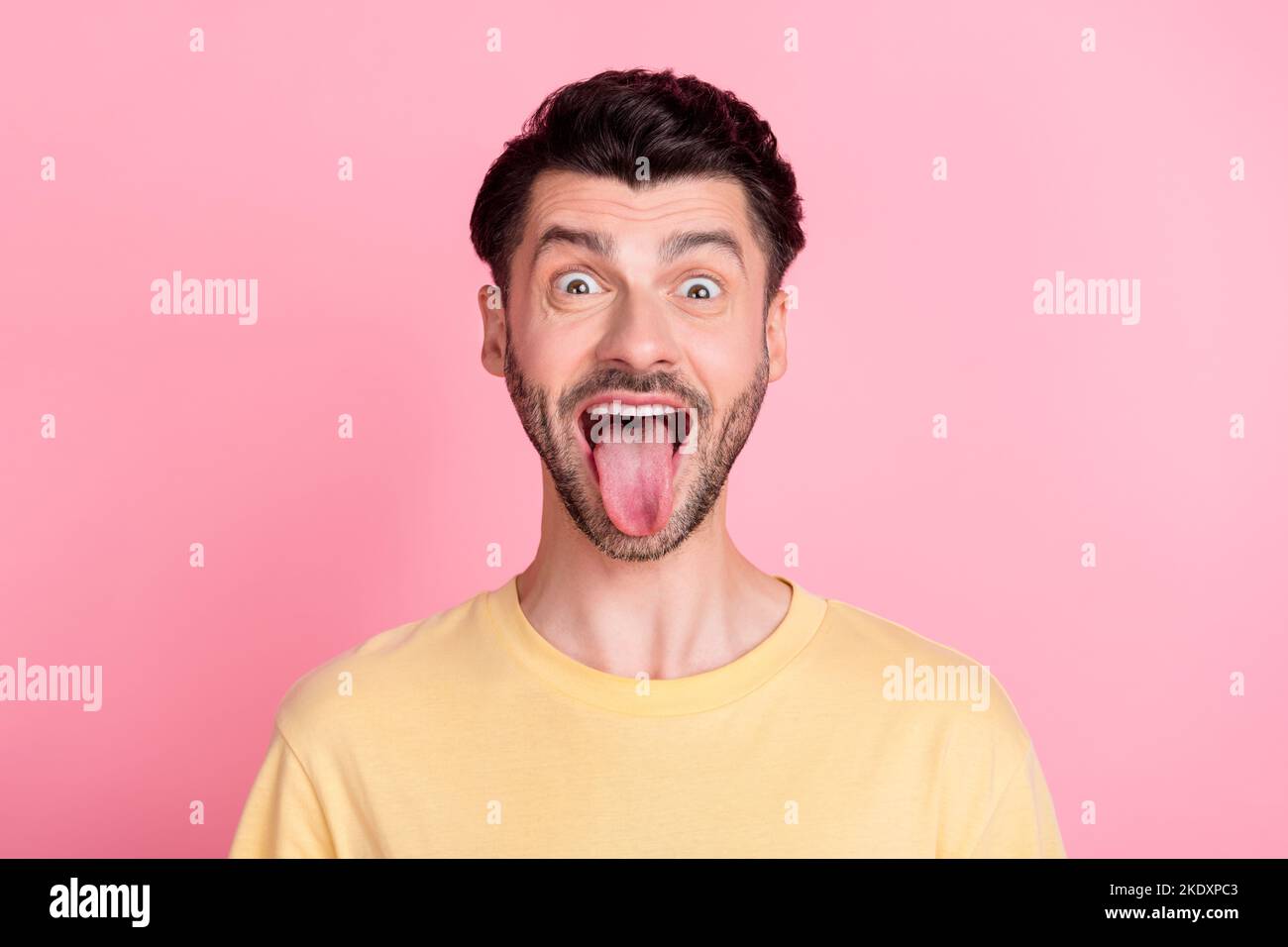 Photo of good mood funky guy with brunet hairstyle dressed yellow t ...