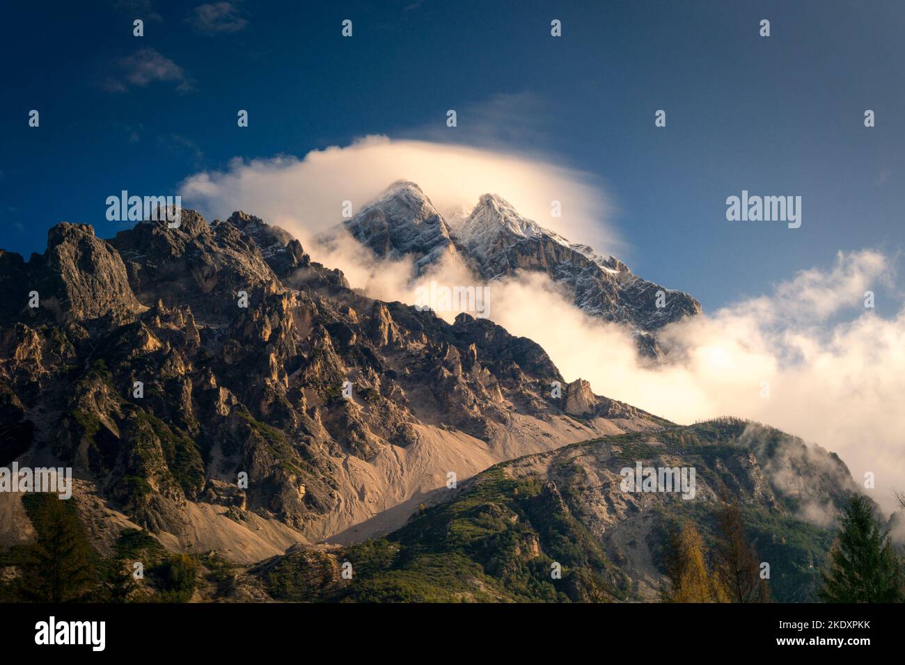 Majestic valley of Dolomite Alps with high mountains and deciduous ...