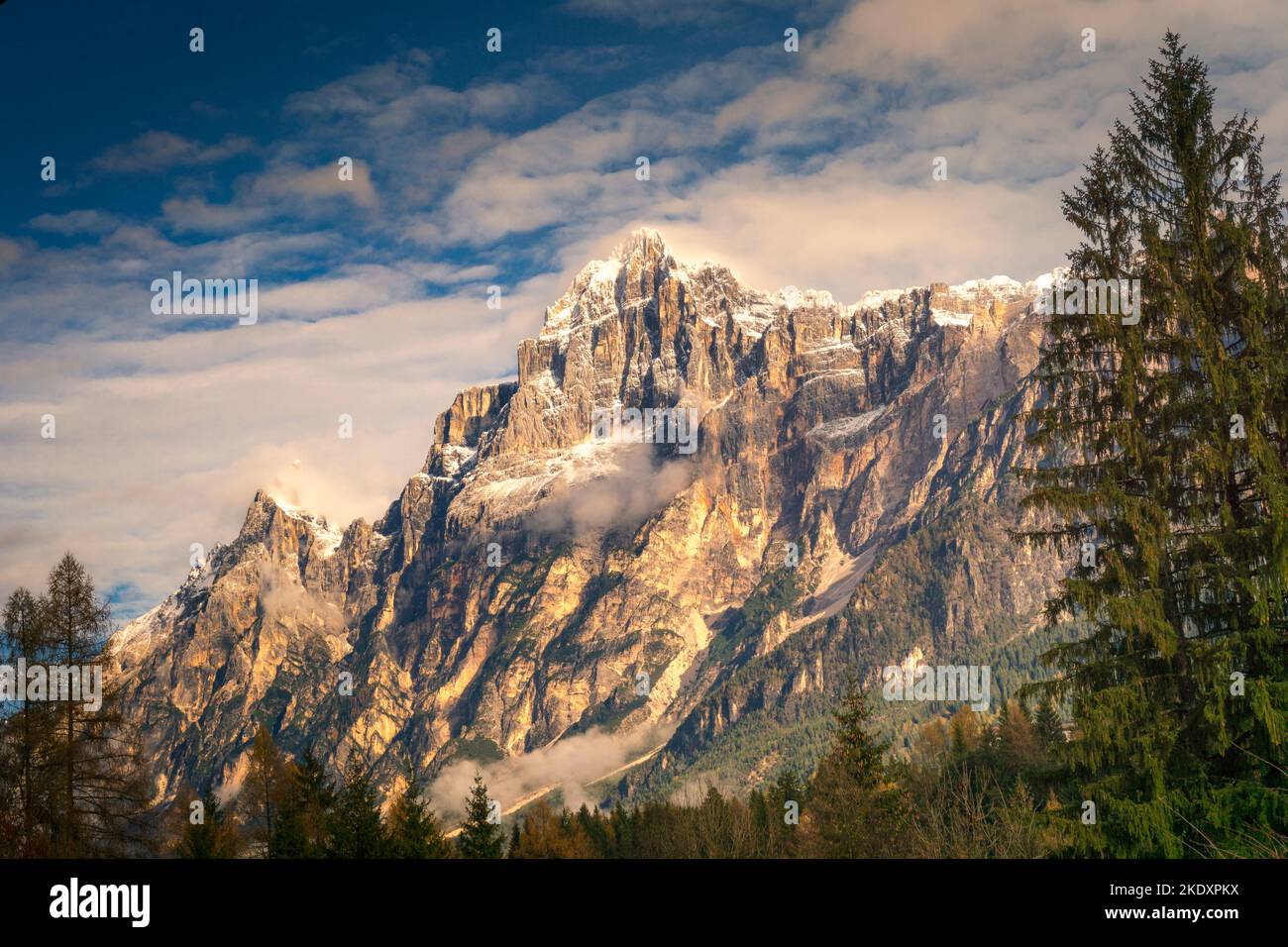 Majestic valley of Dolomite Alps with high mountains and deciduous ...