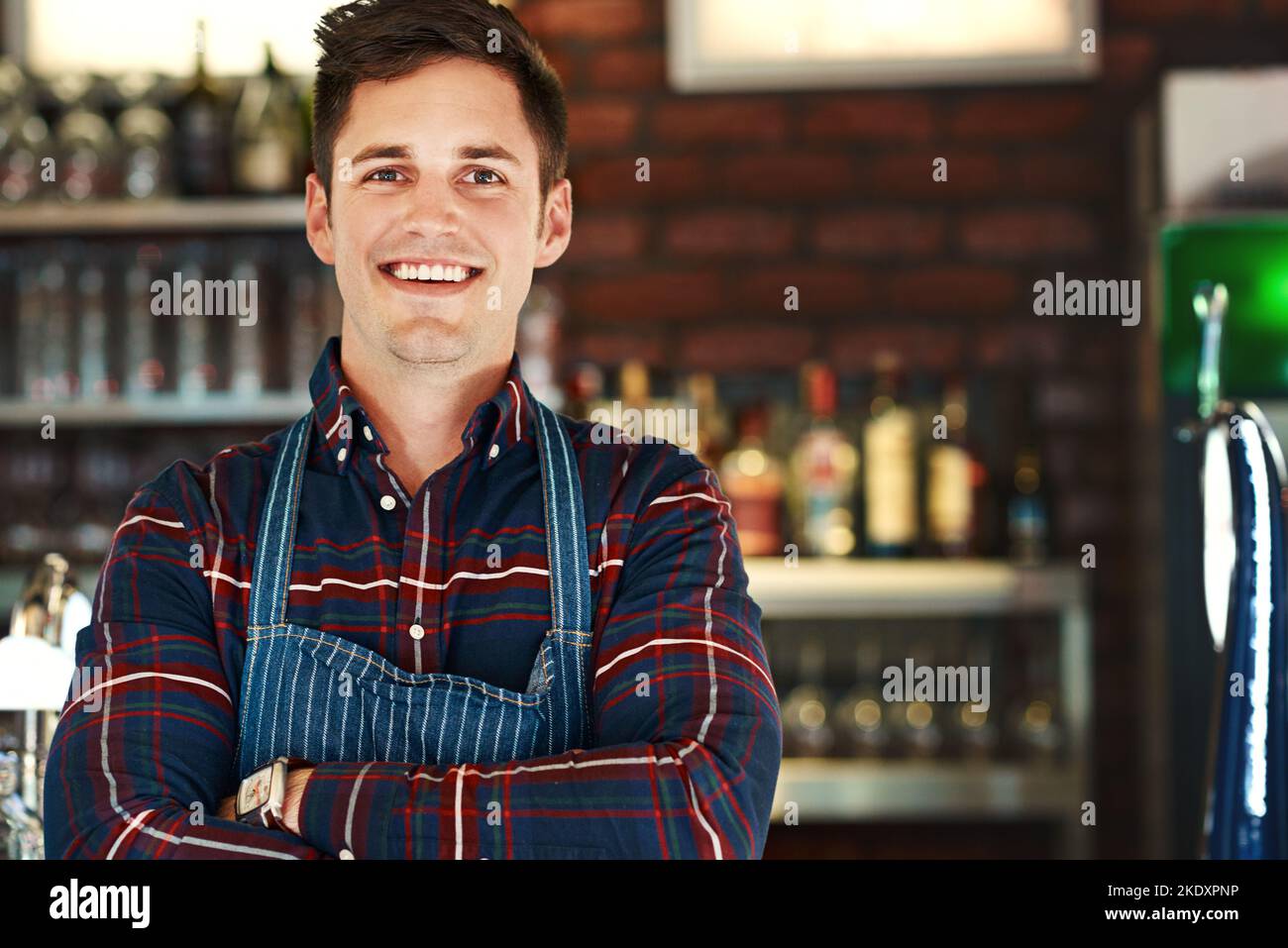 Work hard and stay humble. a young male restaurant owner Stock Photo ...