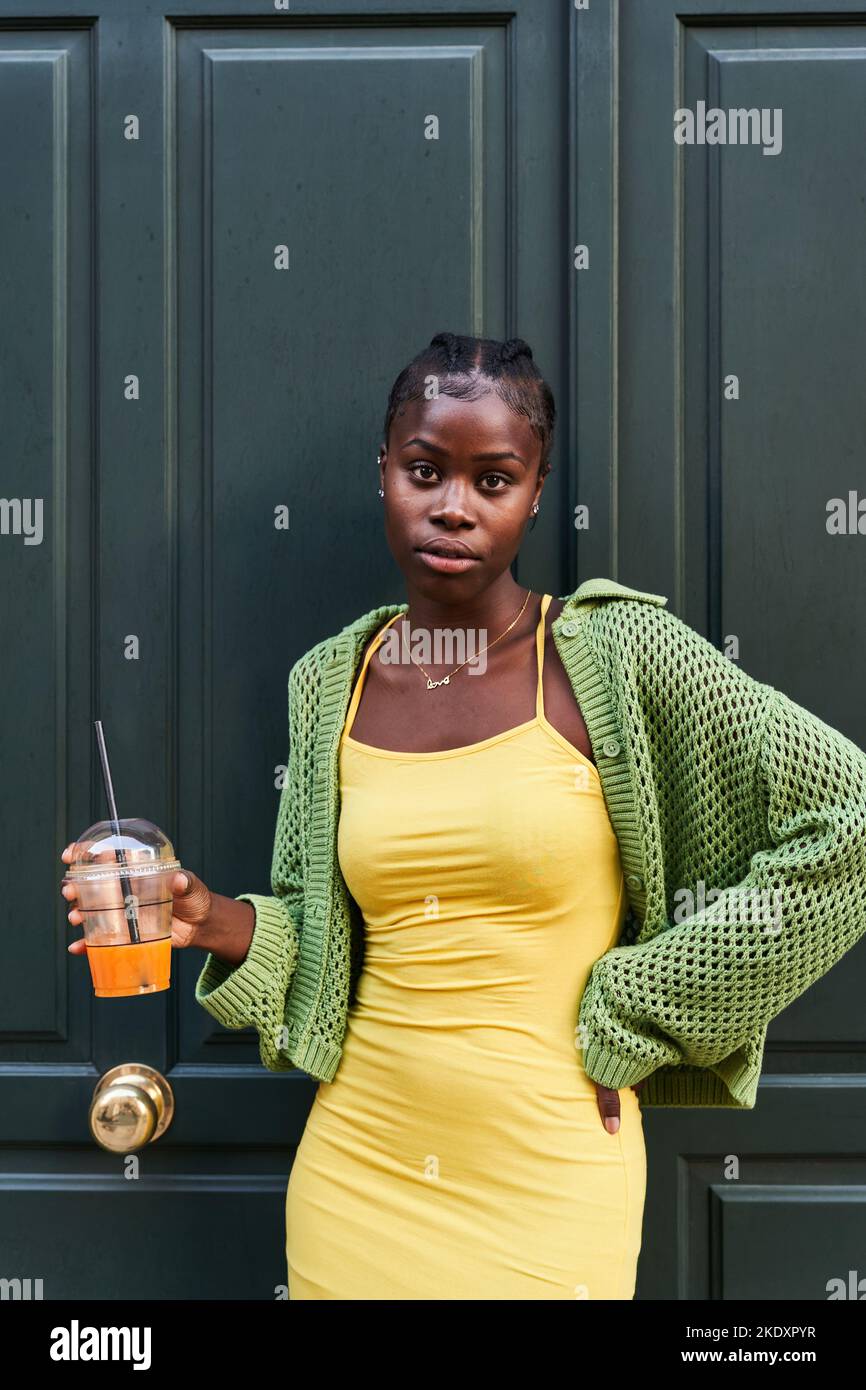 Confident young stylish African American female millennial with dark ...