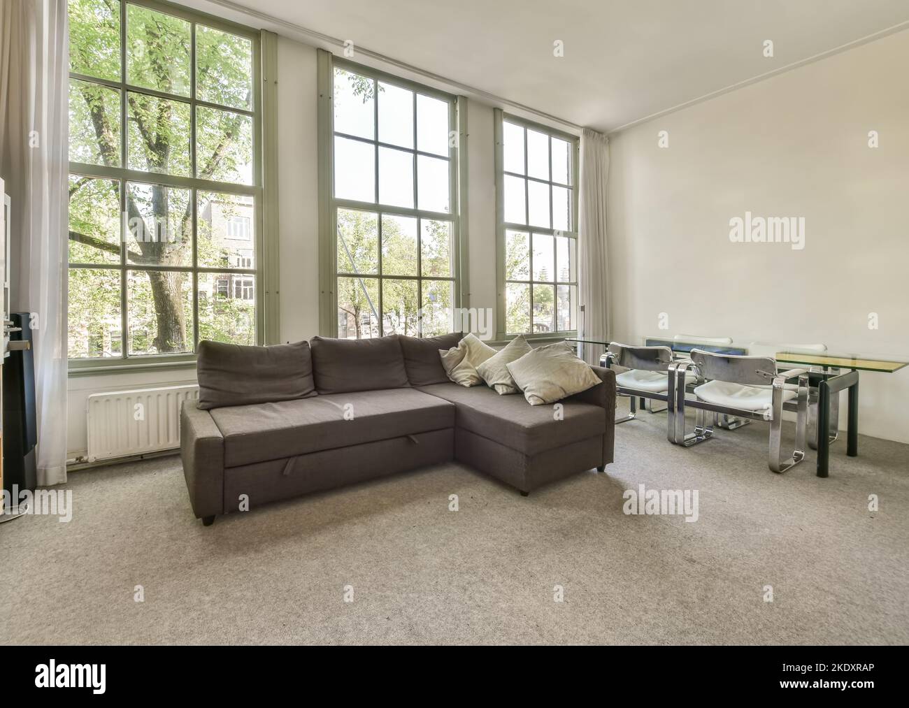 Interior of modern home with furniture next to a bright window Stock ...