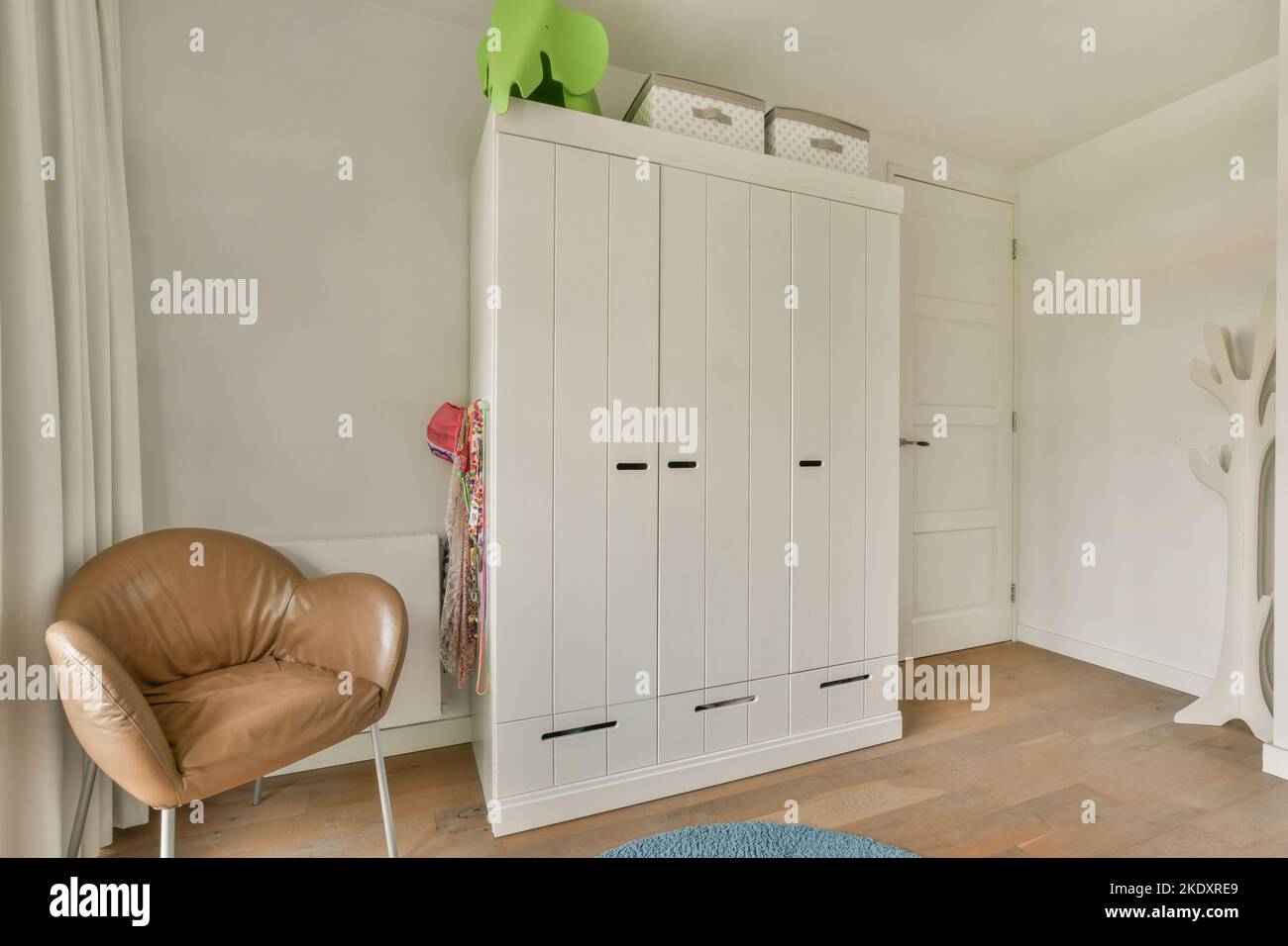 Interior of a modern house with clothes closets and file cabinets next ...