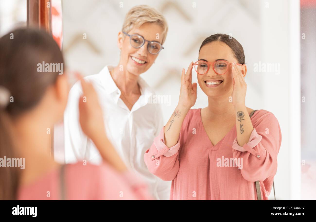 Person looking in mirror in optician hi-res stock photography and ...