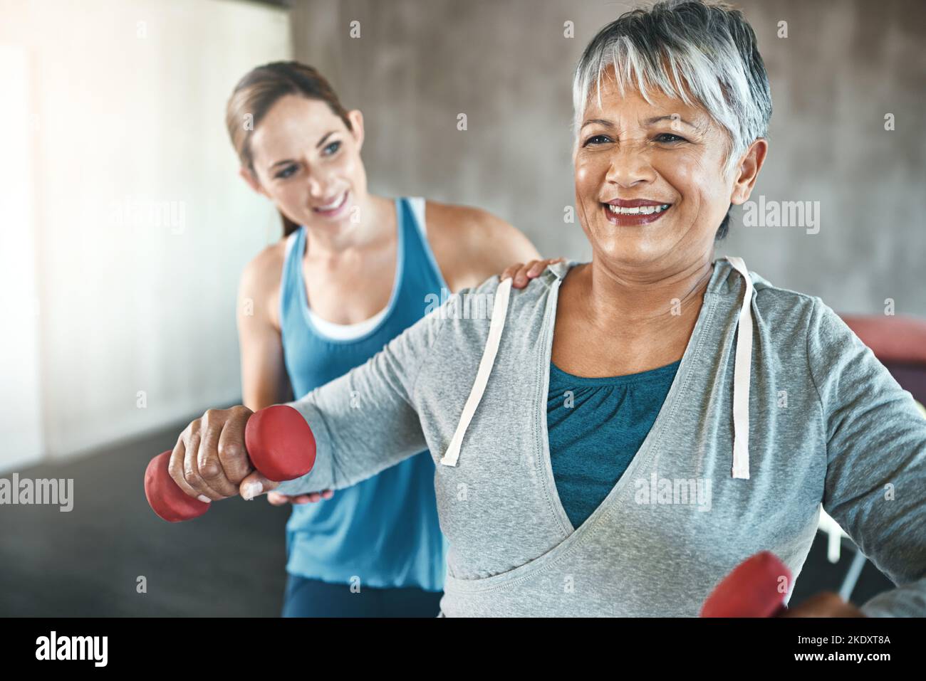 Feel your best at any age with regular exercise. a senior woman using ...