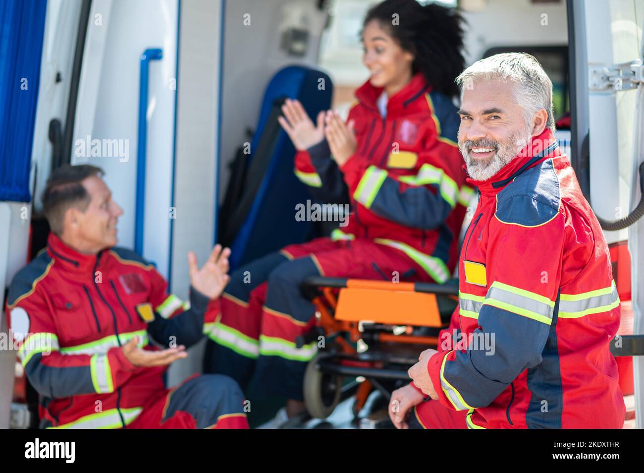 Team of paramedics communicating before their shift Stock Photo - Alamy