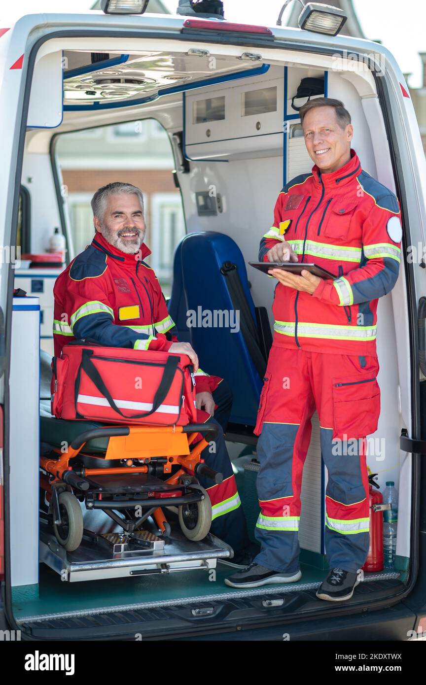 Paramedical staff posing for the camera in the EMS vehicle Stock Photo ...