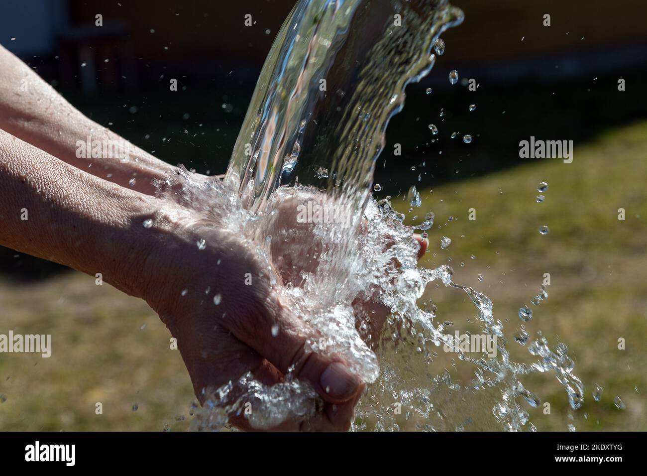 Human hands splashing pure water hi-res stock photography and images ...