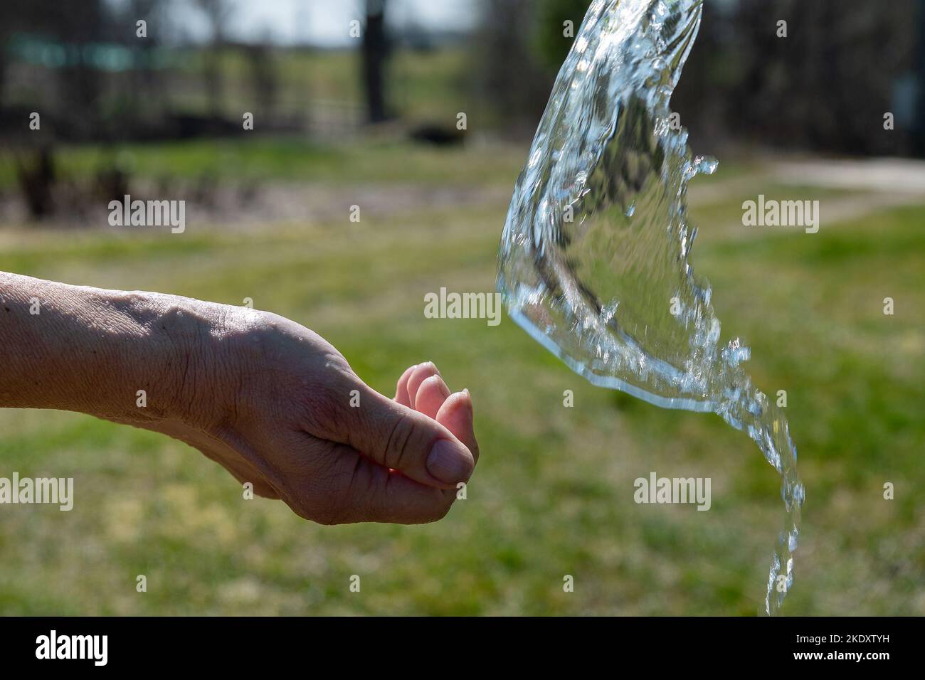 Human hands splashing pure water hi-res stock photography and images ...