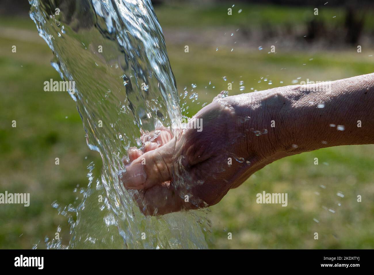Human hands splashing pure water hi-res stock photography and images ...
