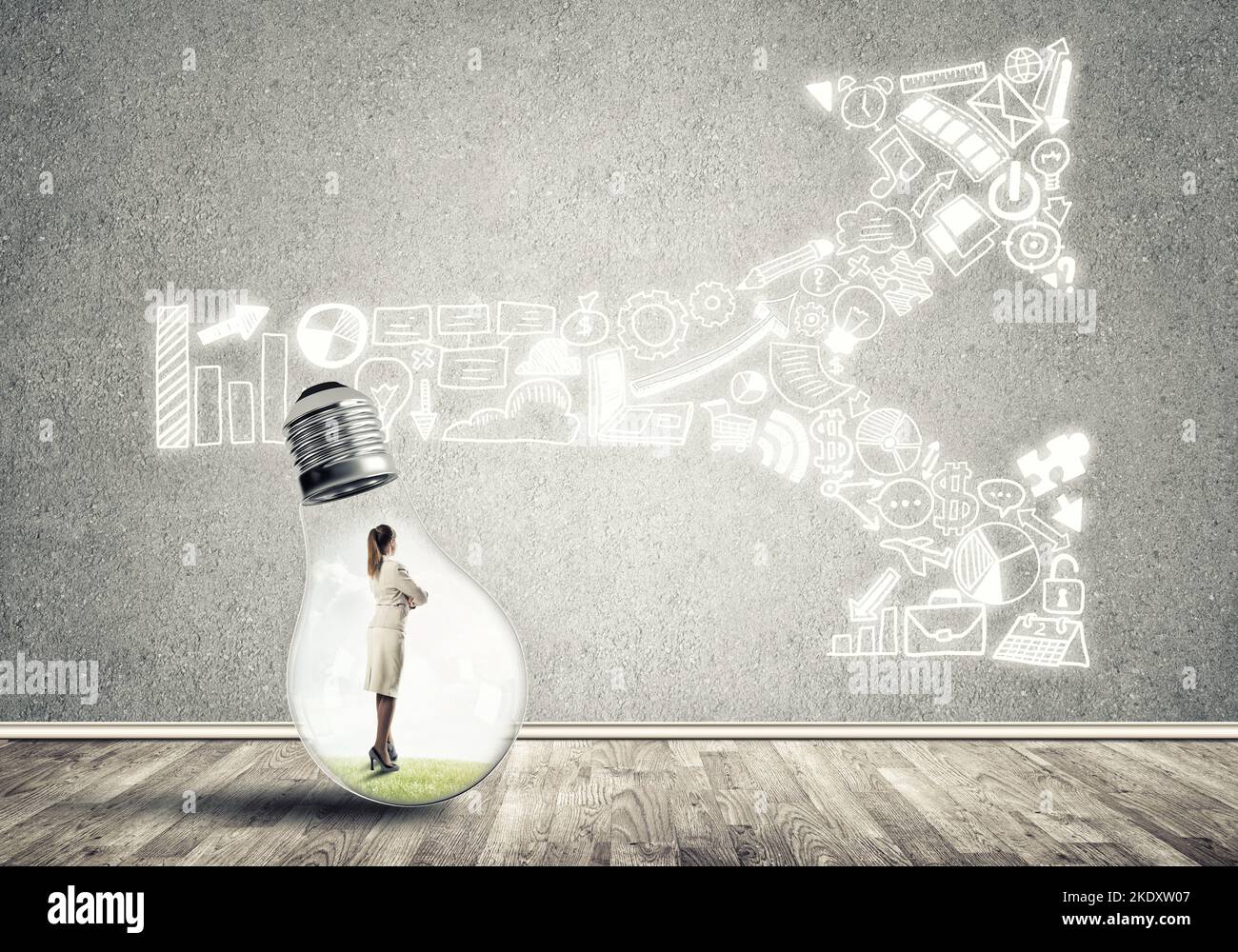 Businesswoman trapped in bulb Stock Photo - Alamy