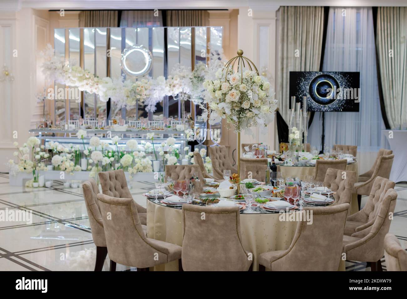 Tables setting at a luxury wedding. Table for guests. Dishes and drinks ...