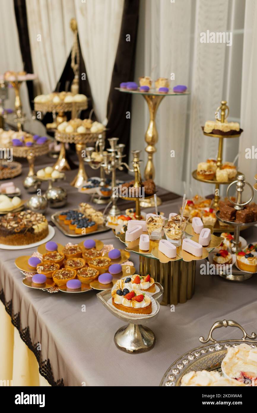 Table with cakes, sweets, candy, buffet. Dessert table for a party ...