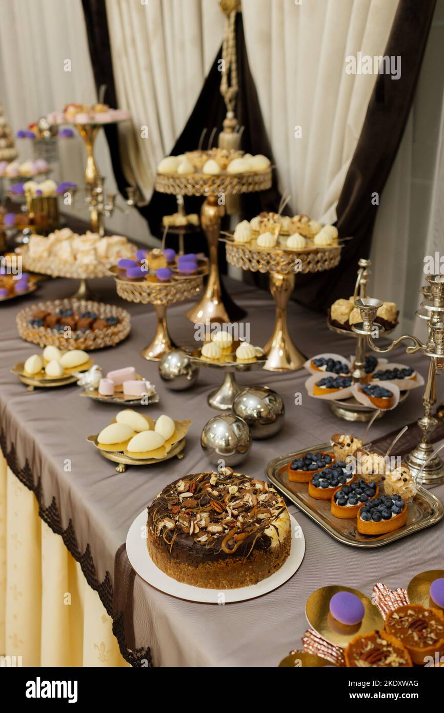 Table with cakes, sweets, candy, buffet. Dessert table for a party ...