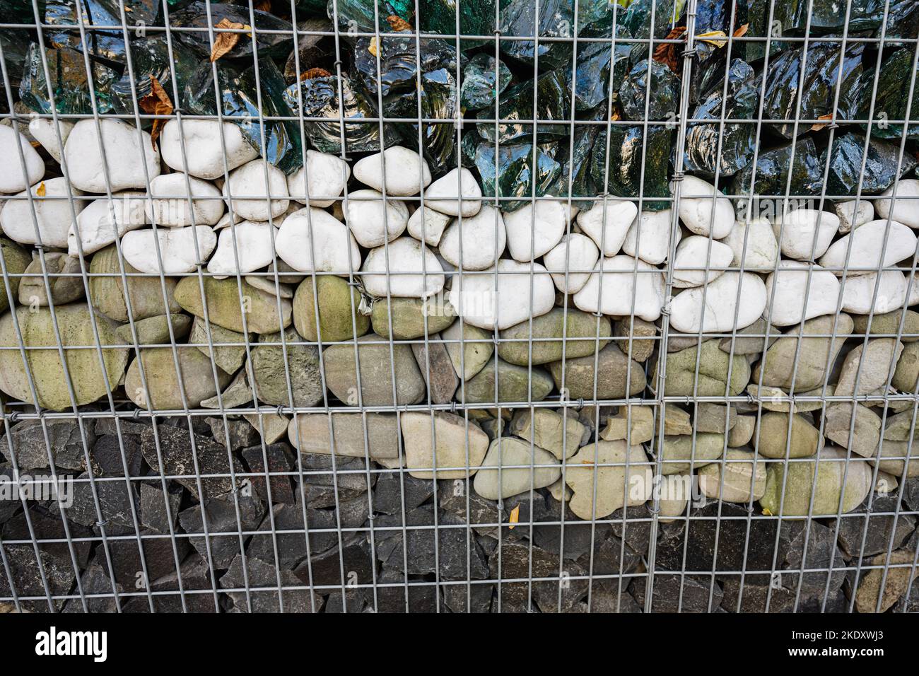 Strong wall with different stones made from pebbles inside of ...