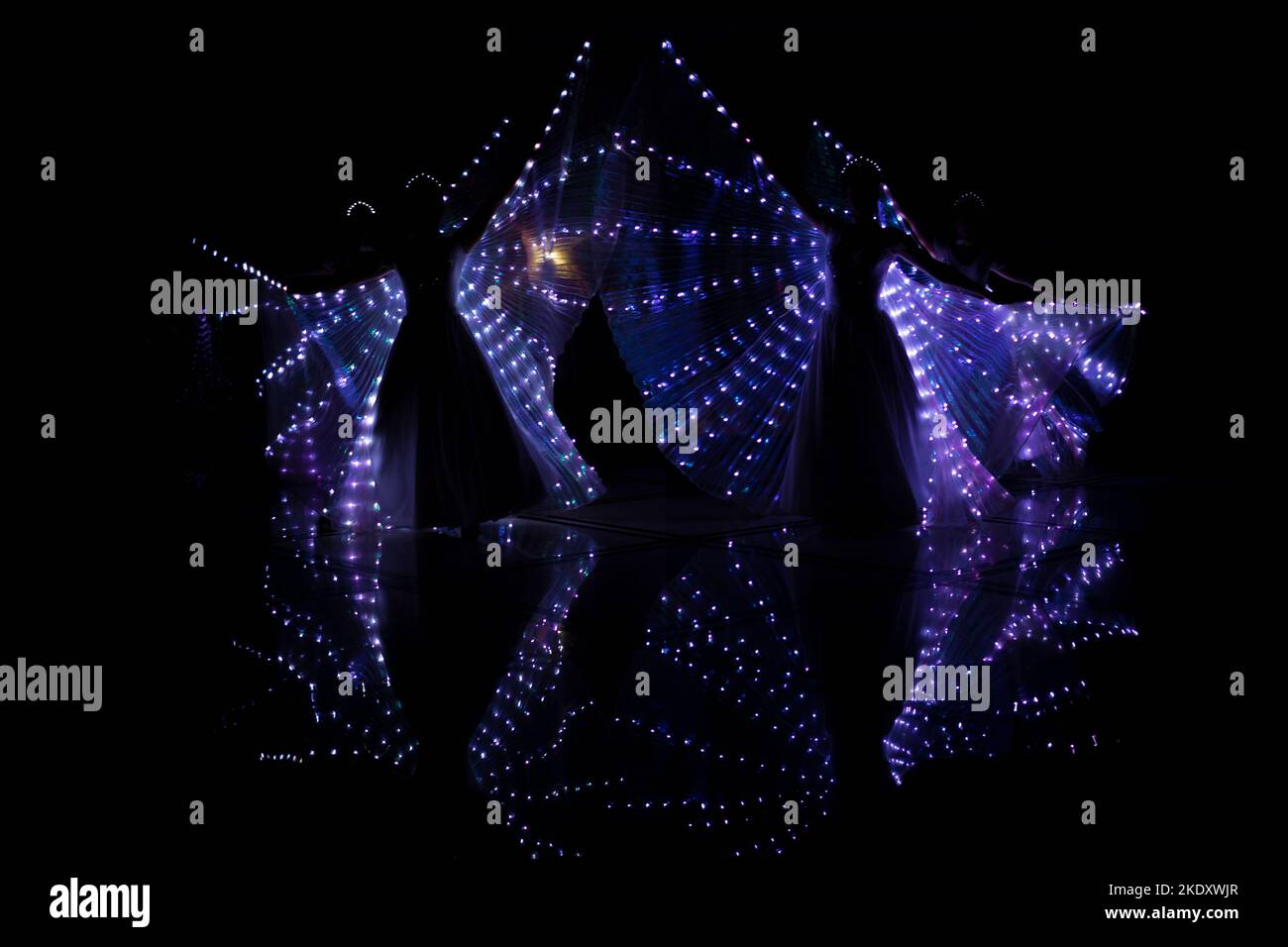 Laser show performance, dancers in suits with LED lamp, very beautiful ...
