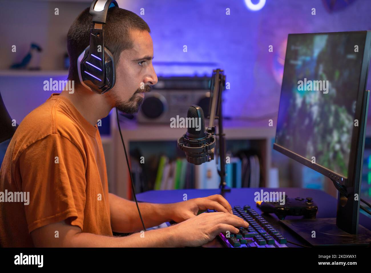 Professional Gamer Streaming and Playing Online Video Game on Computer ...