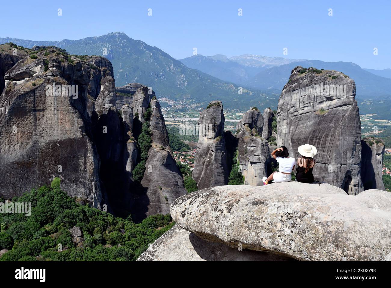 Greece, two unidentified woman enjoy a view over the great scenery of ...