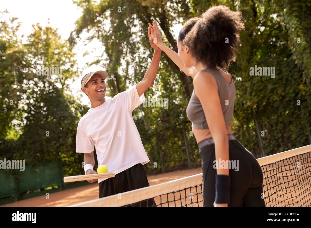 Young people feeling excited after a good tennis game Stock Photo - Alamy