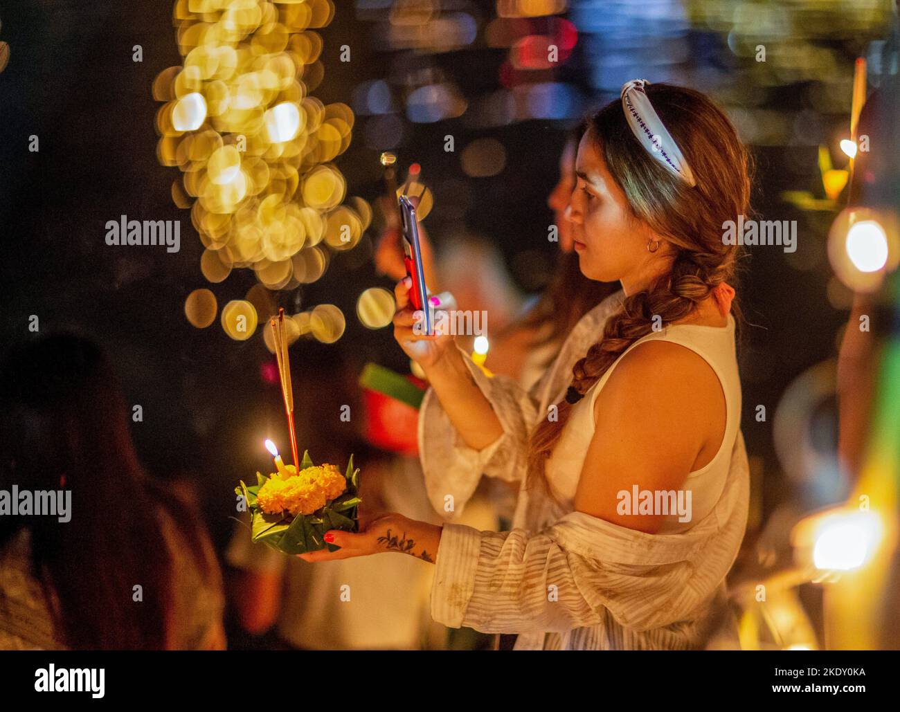 Foreign tourist hold "Krathong" and takes a photo during the Loy ...