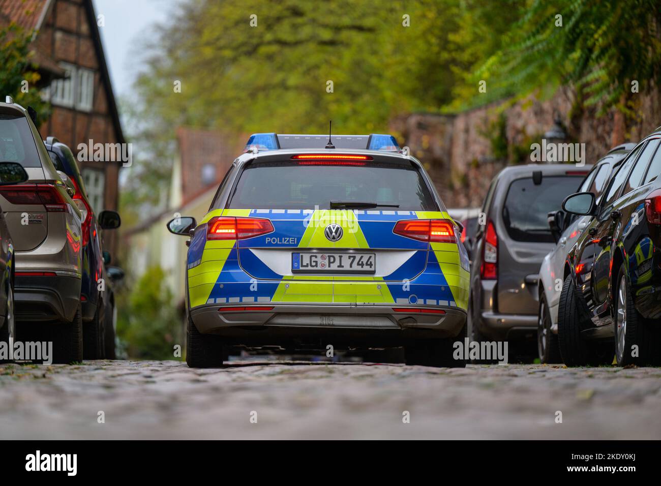 09 November 2022, Lower Saxony, Lüneburg: A police patrol car drives ...