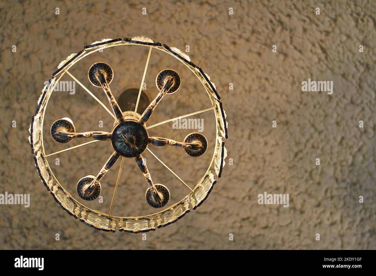 Antique chandelier hangs on the ceiling. View from below. Lighting ...
