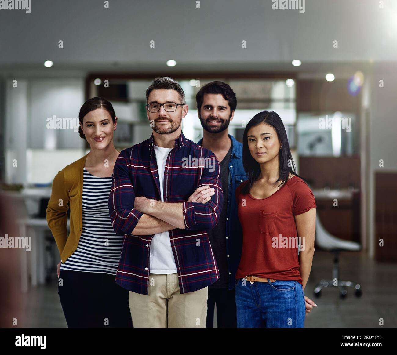 They are the team to beat. Portrait of group of businesspeople standing ...