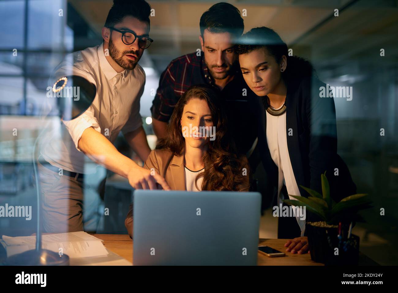 Getting closer to that aha moment. a group of businesspeople using a ...