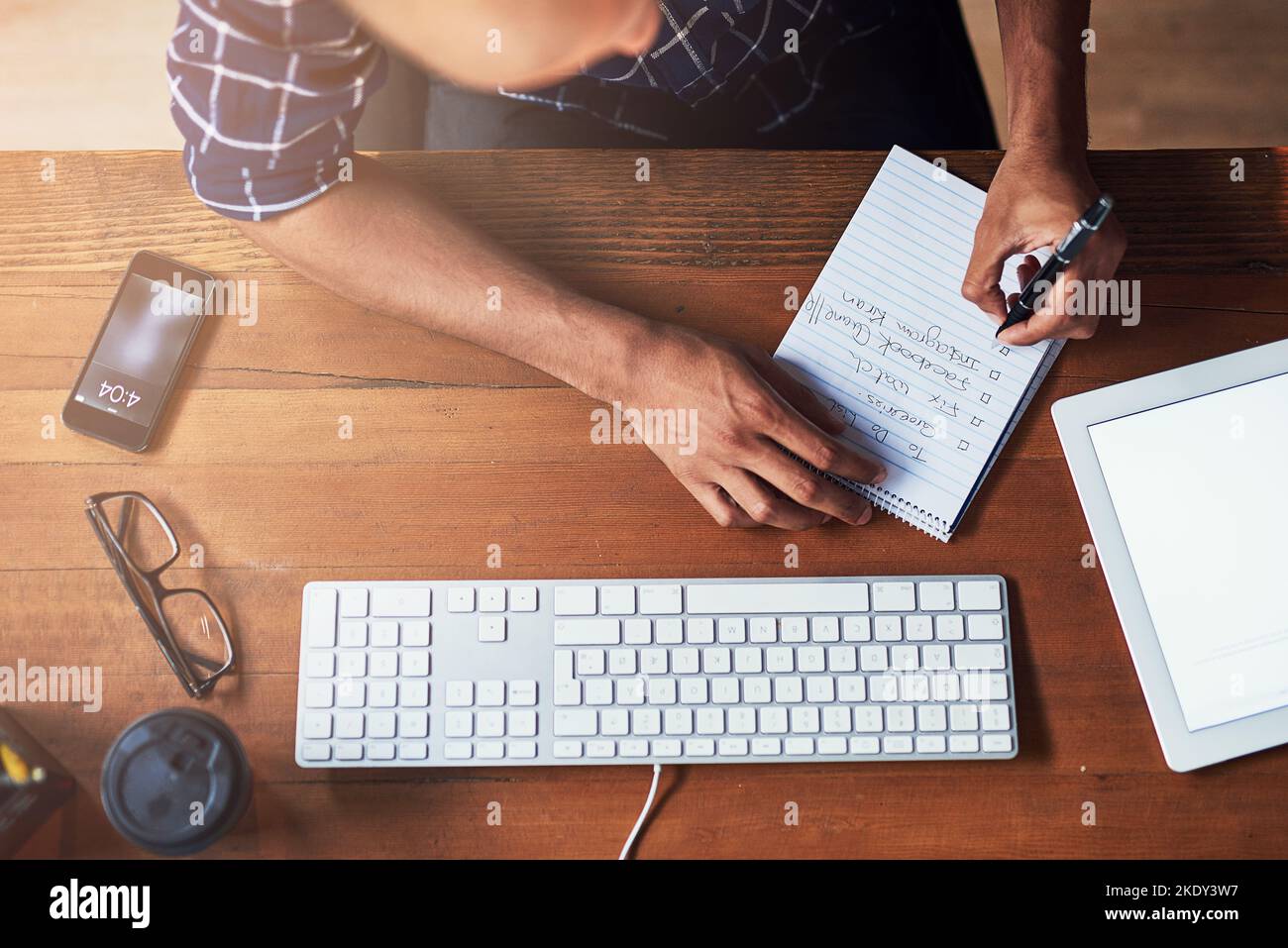 Its important to organise and prioritise your workload. High angle shot of an unidentifiable man ...