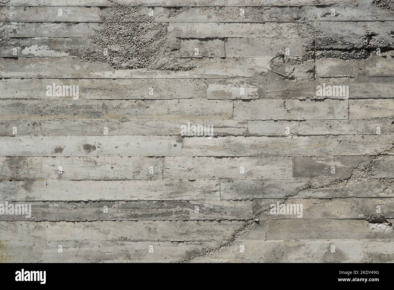 Grey rough textured concrete wall, wood plank board formed concrete ...