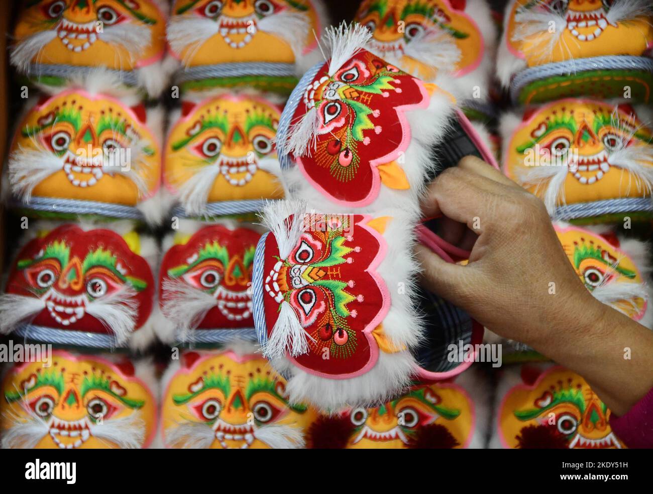 HANDAN, CHINA - NOVEMBER 7, 2022 - A craftsman shows a stitched tiger ...