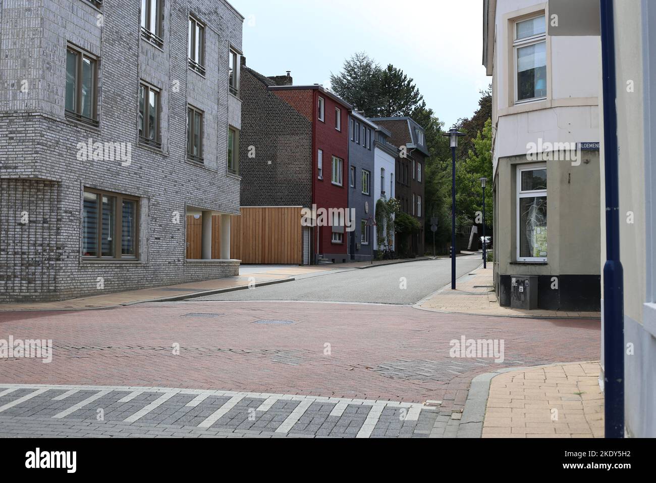 A view of empty street with low-rise residential buildings Stock Photo ...