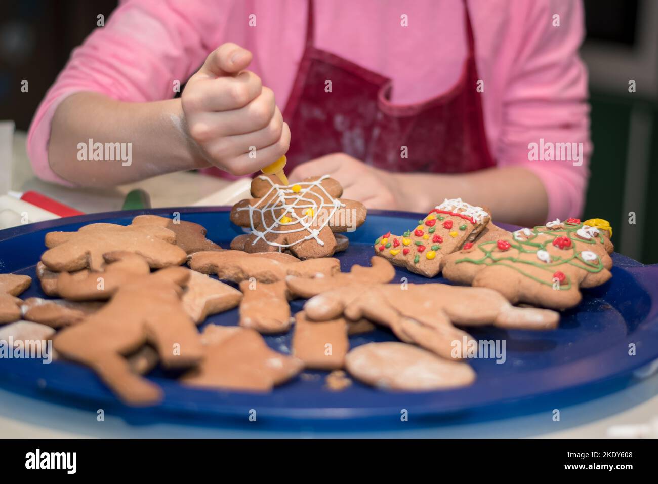 child adorning with colors gingerbread biscuits for christmas Stock ...