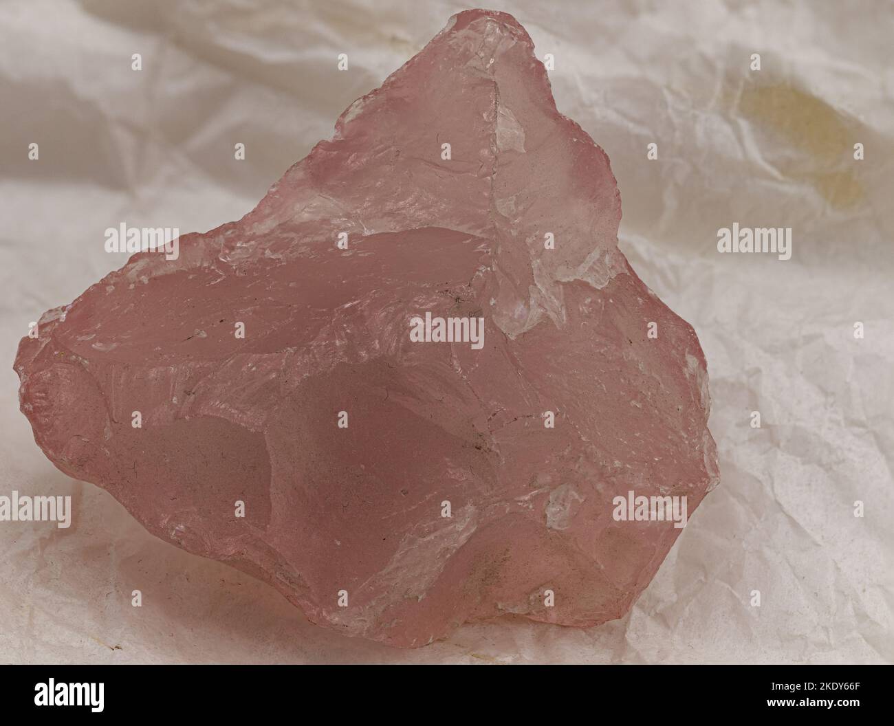 pink quartz gemstone isolated on a white background Stock Photo - Alamy