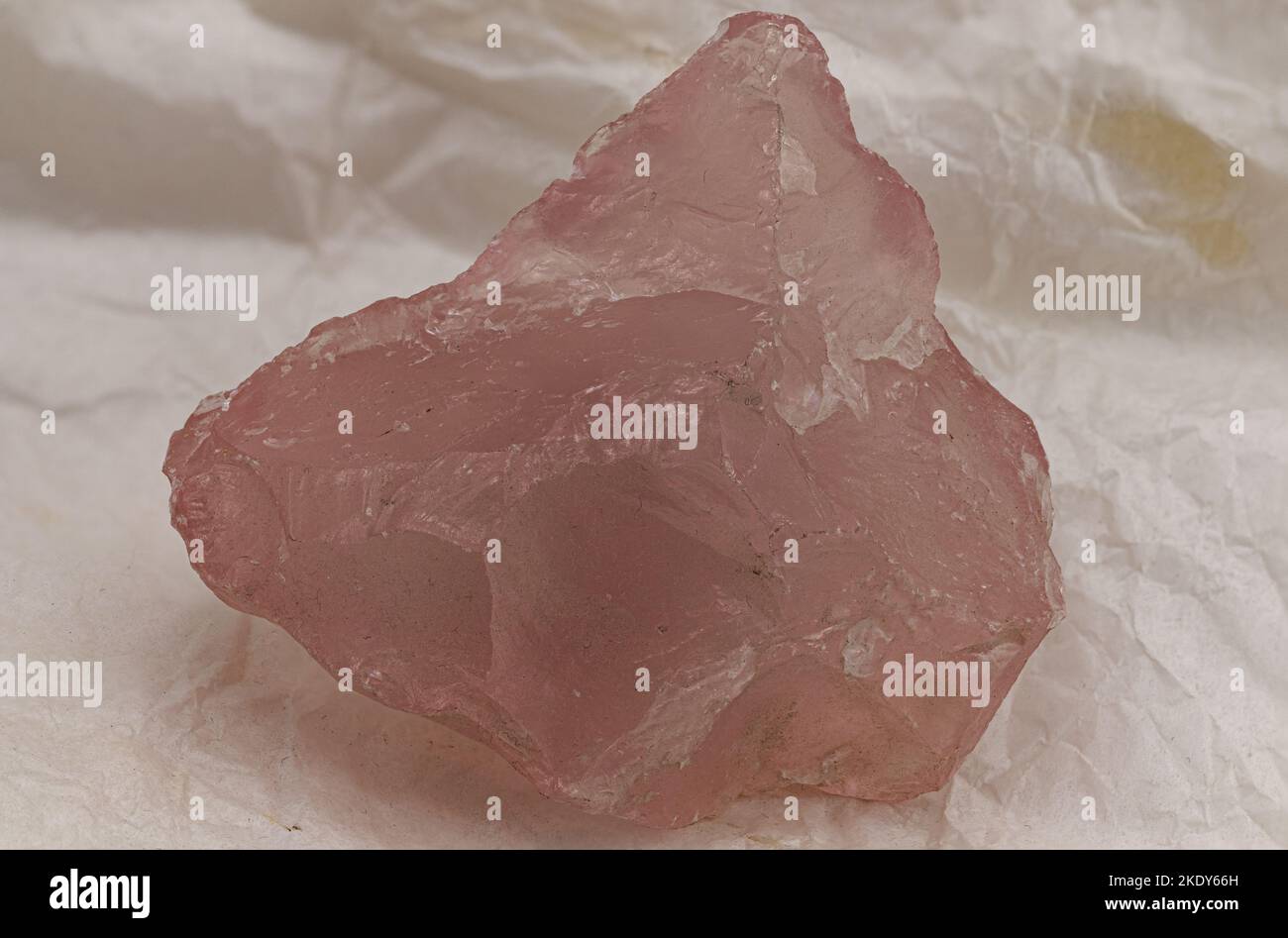 pink quartz gemstone isolated on a white background Stock Photo - Alamy