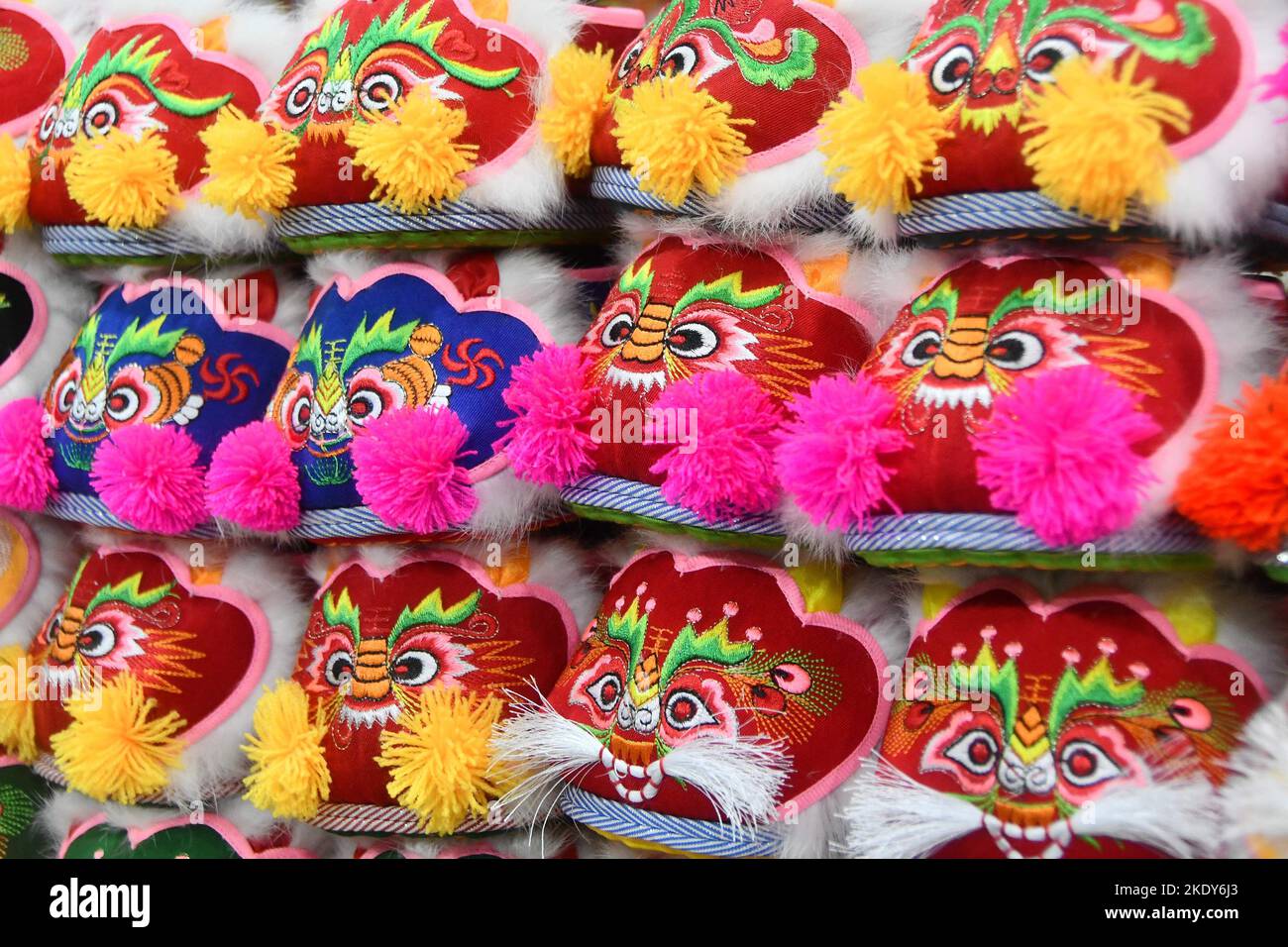 HANDAN, CHINA - NOVEMBER 7, 2022 - Handicrafts sew tiger-head shoes in ...
