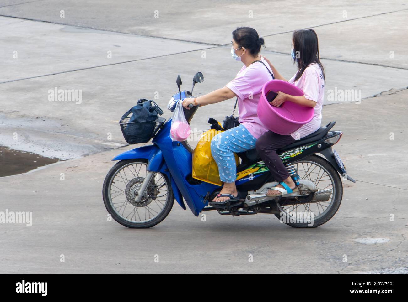 SAMUT PRAKAN, THAILAND, SEP 29 2022, wo women rides on motorcycle at ... SAMUT PRAKAN, THAILAND, SEP 29 2022, wo women rides on motorcycle at ...