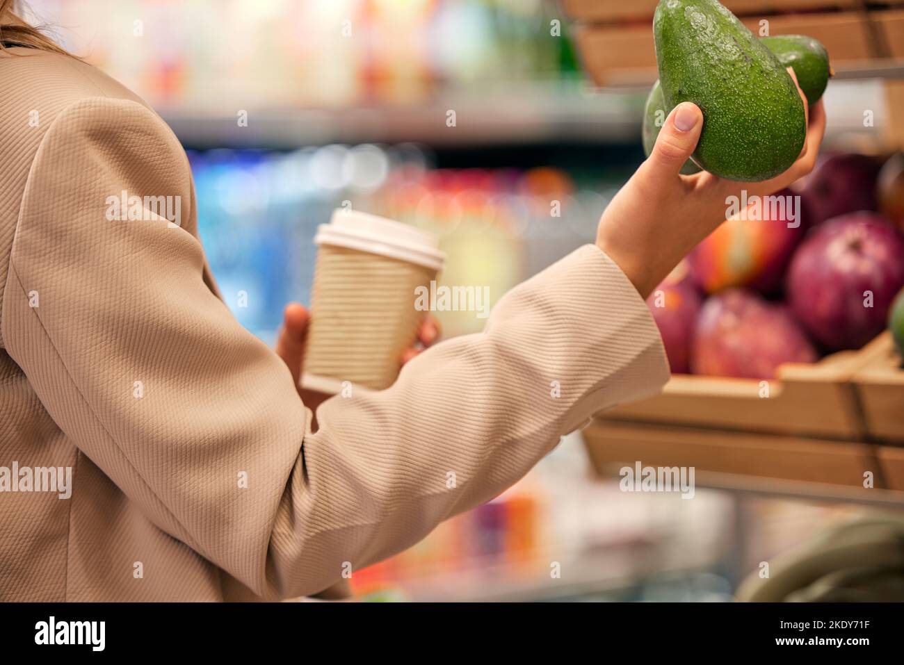 Supermarket, avocado and woman hand shopping for fruit, fresh and ...