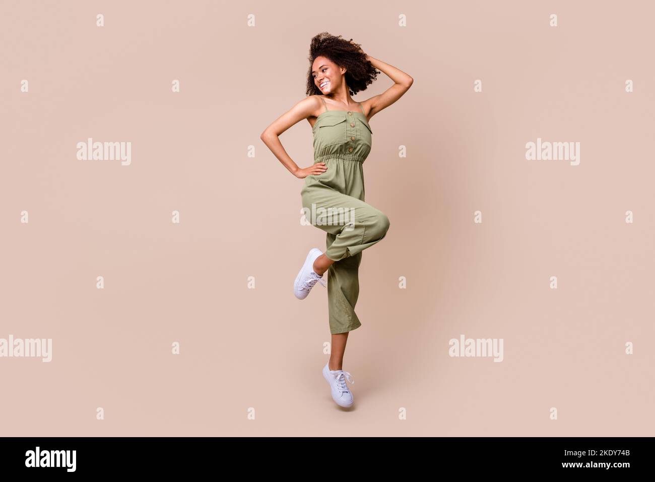 Full body photo of stunning young woman curly hair jump defile look ...