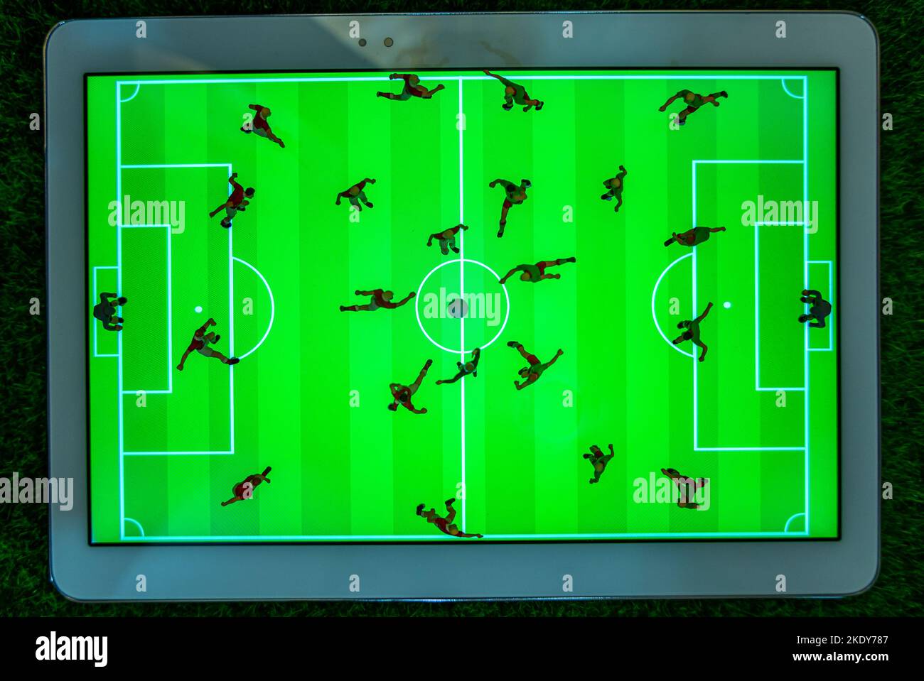 Top view of miniature toys figurines football (soccer) players on a ...