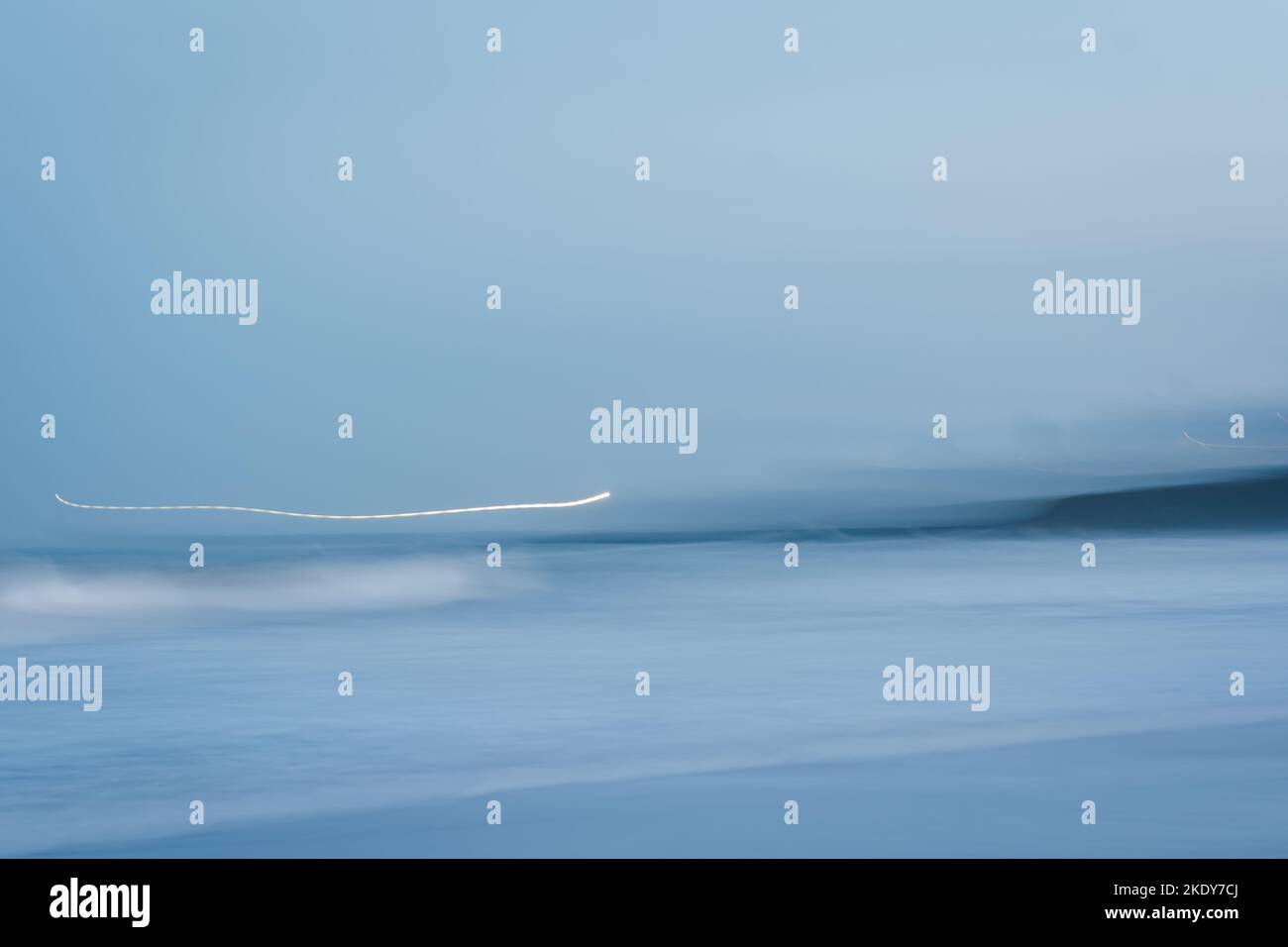 Slow shutter movement ICM of blue sunset at Tynemouth Longsands beach ...
