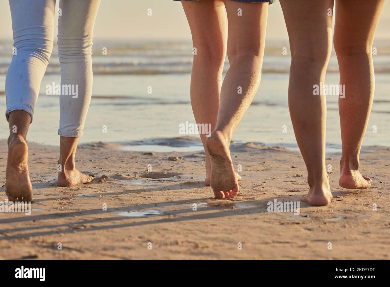 People feet, sand and walking on beach steps in summer vacation ...