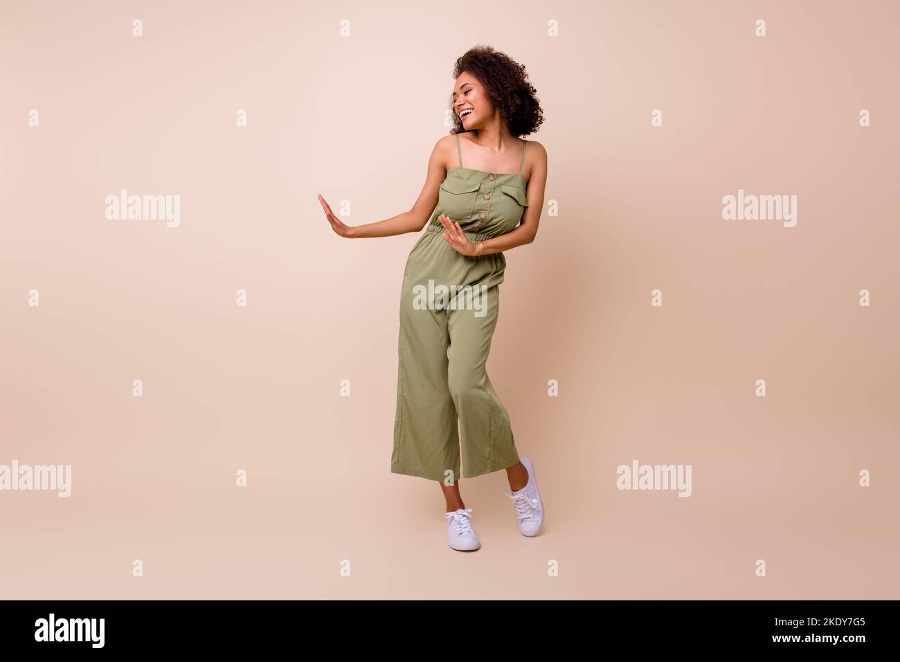 Full size photo of gorgeous positive girl with curly hairdo dressed ...
