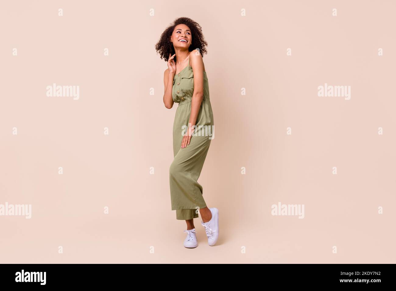 Full body photo of nice young lady curly hair try on new outfit look ...