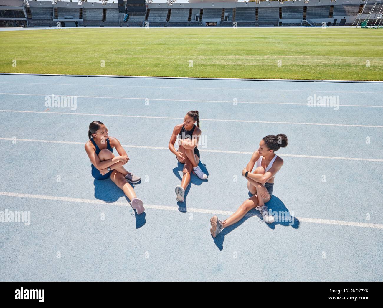 Runner group, women and stretching on ground for fitness, talk or sport ...
