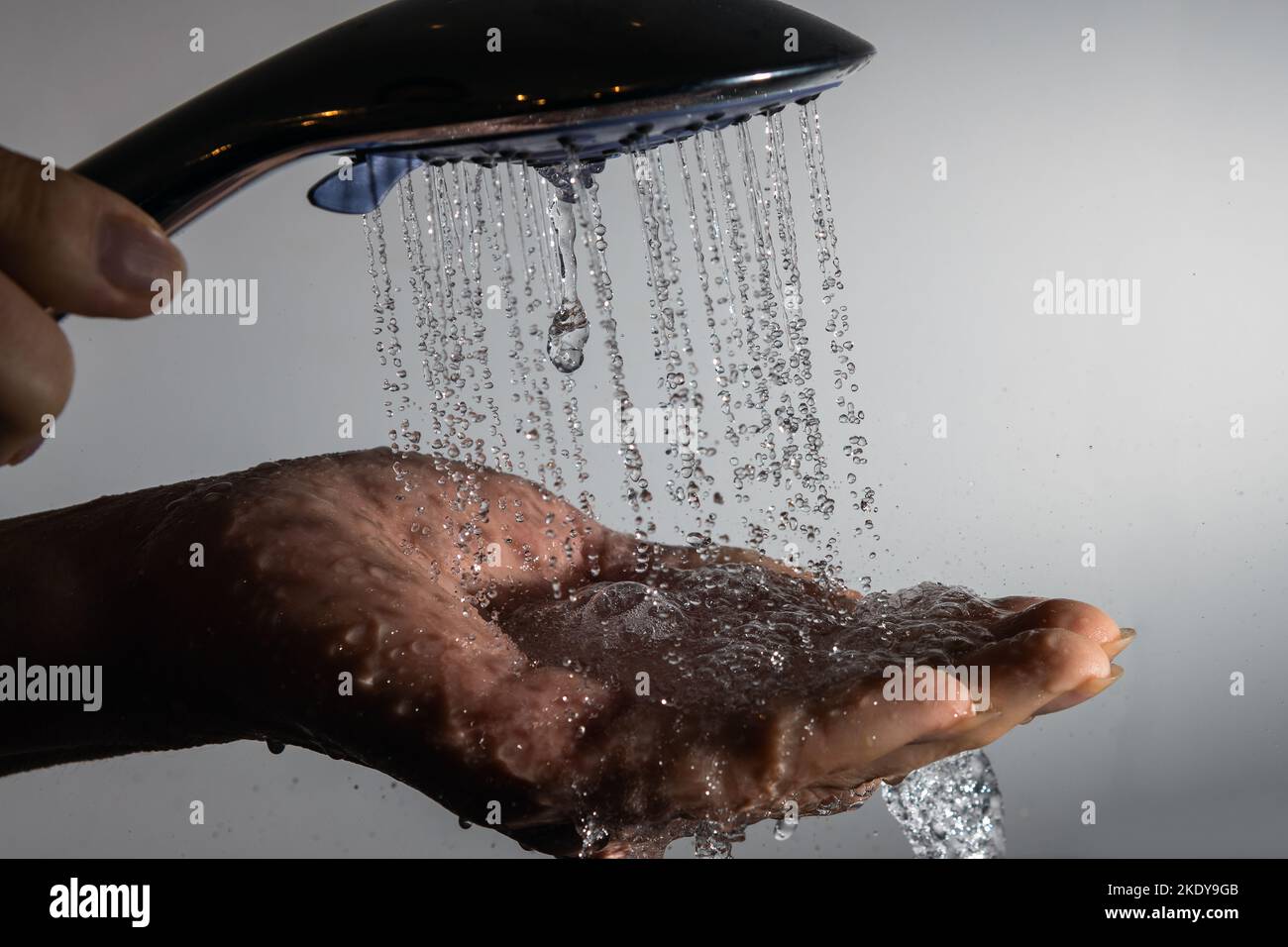 Shower head and human hand Stock Photo - Alamy