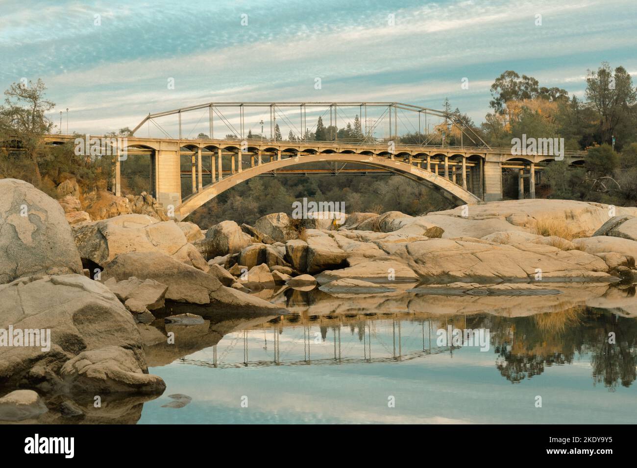 The reflection of the Rainbow Bridge in lake Natoma in Folsom ...