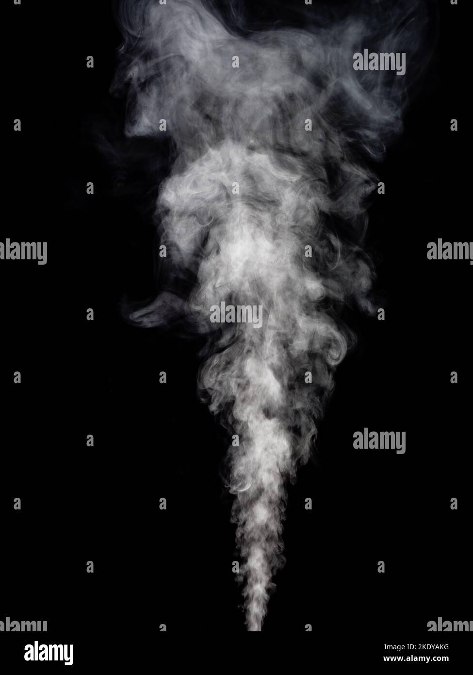Spectacular white smoke rises in a thick stream against a black ...