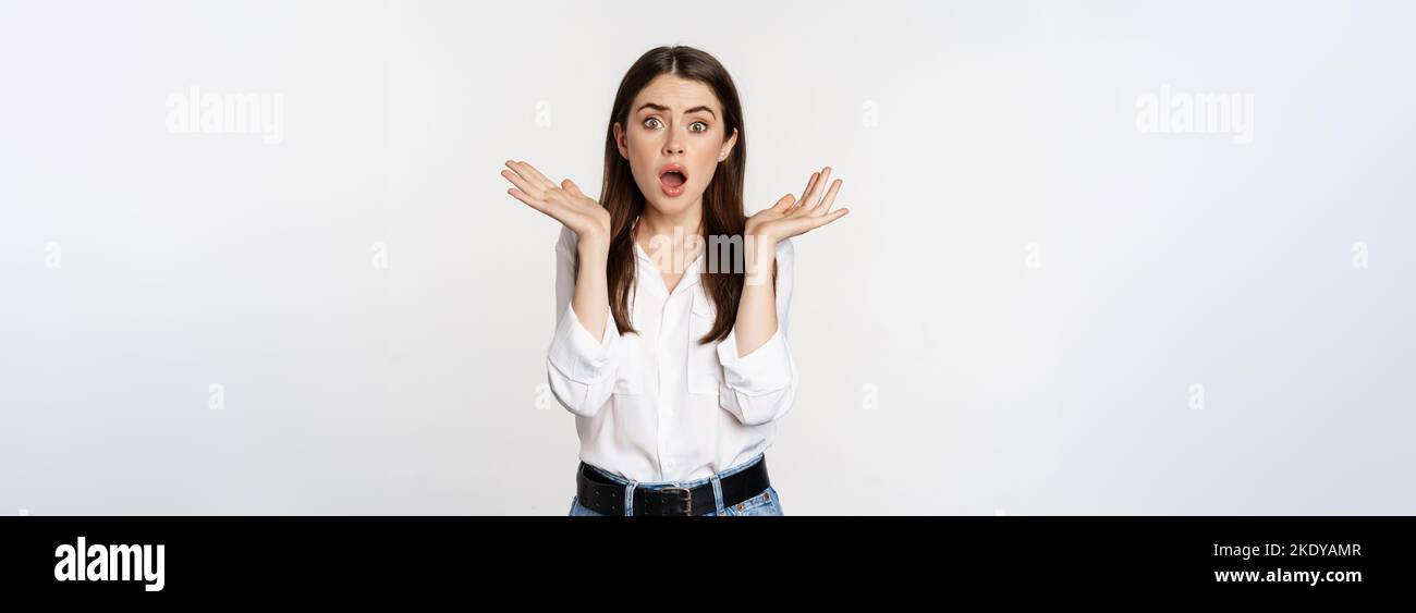 Portrait of concerned female model looking shocked, surprised face ...